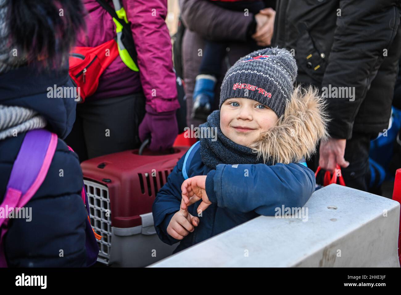 Medyka, Poland. 11th Mar, 2022. A Ukrainian refugee child smiles while ...