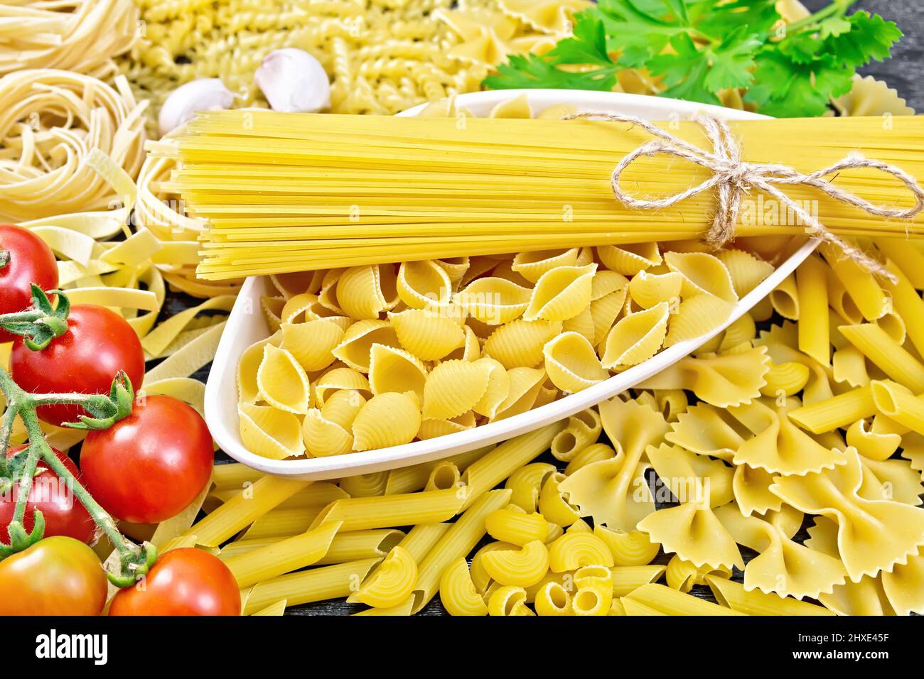 Pasta seashells and spaghetti in bowl, pipe rigate, tagliatelle ...