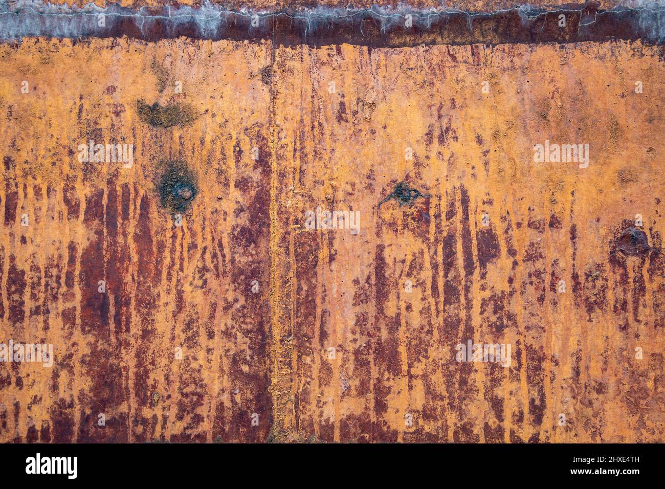 Rusty stained and marked stone wall for texture or background Stock ...