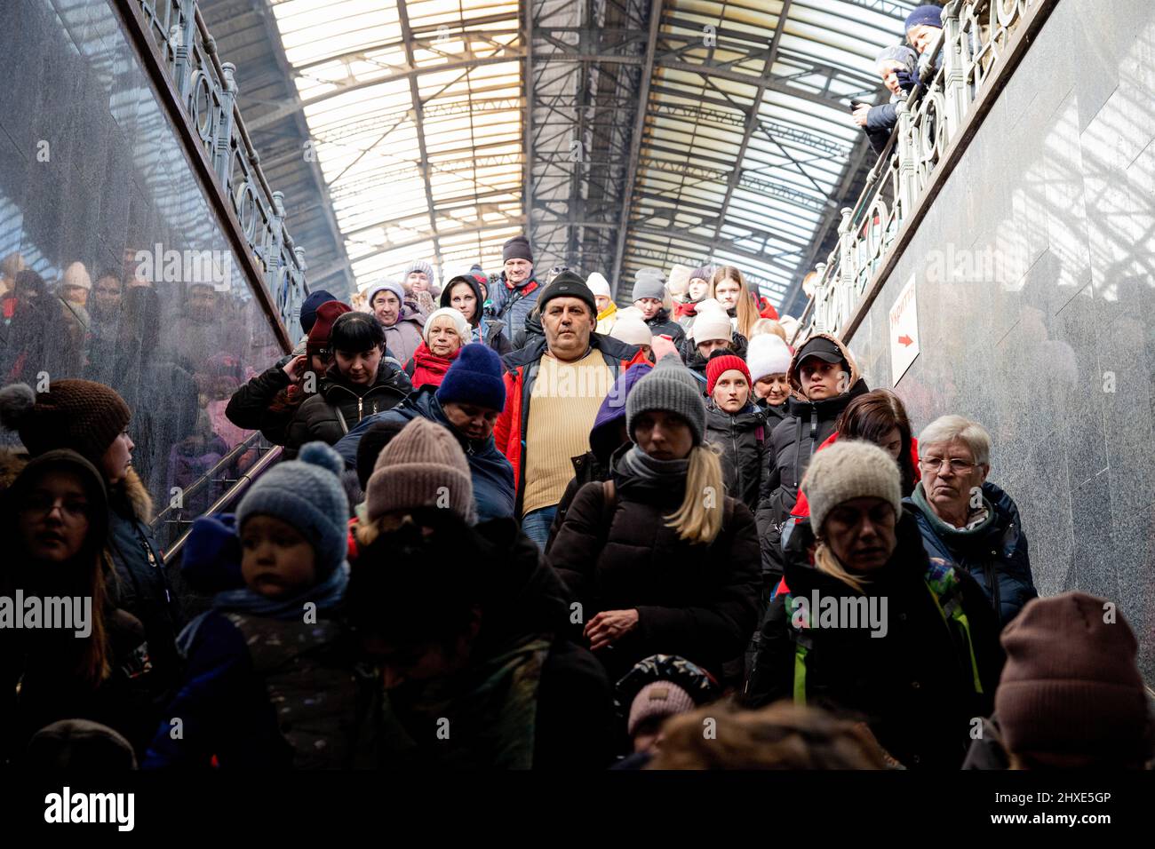 Crowds of people are getting off the platform at the Lviv train station ...