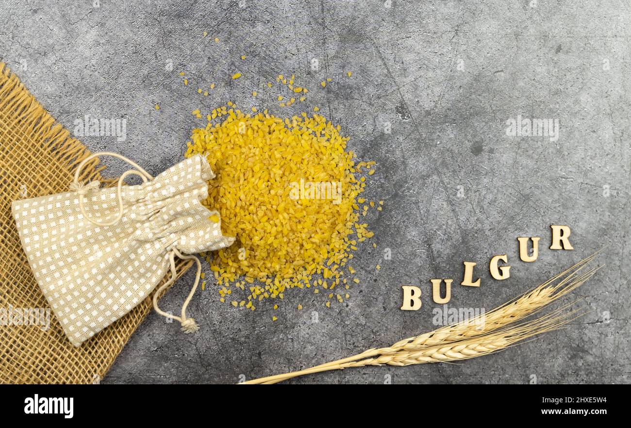 bulgur, cereal made from boiled, dried and crushed wheat. grains poured ...