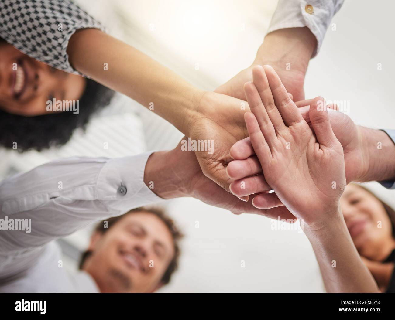 Together is the way forward. Low angle shot of a group of colleagues ...