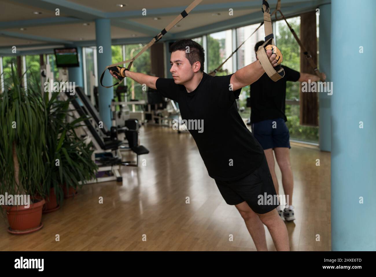 Functional Fitness Workout in Sport Gym With Suspension Training Trx ...