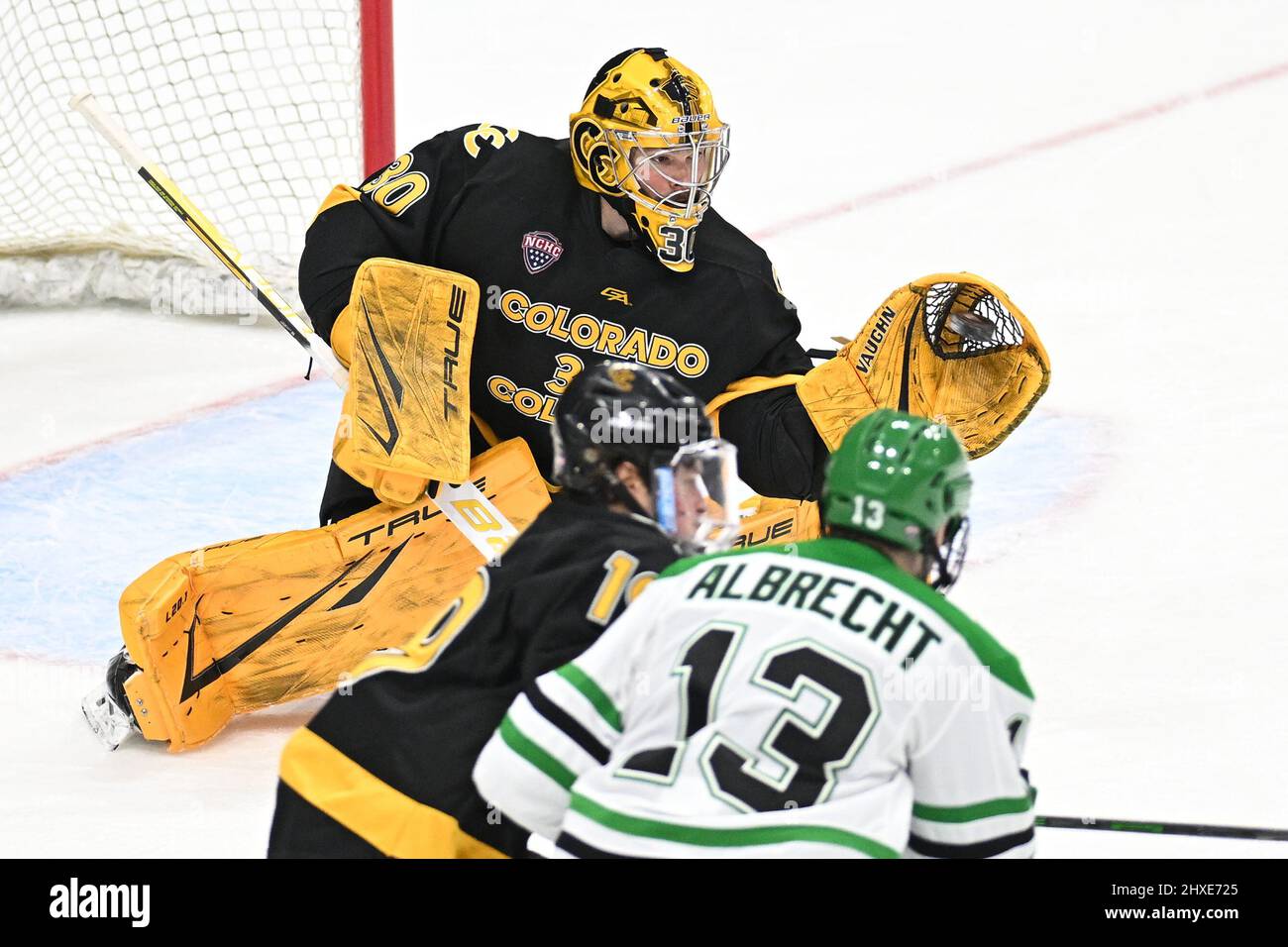 Colorado College Tigers goaltender Matt Vernon (30) gloves a shot ...