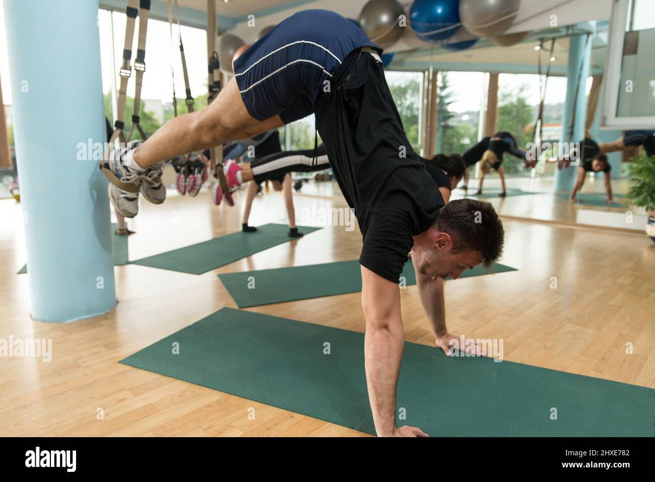 Functional Fitness Workout in Sport Gym With Suspension Training Trx ...