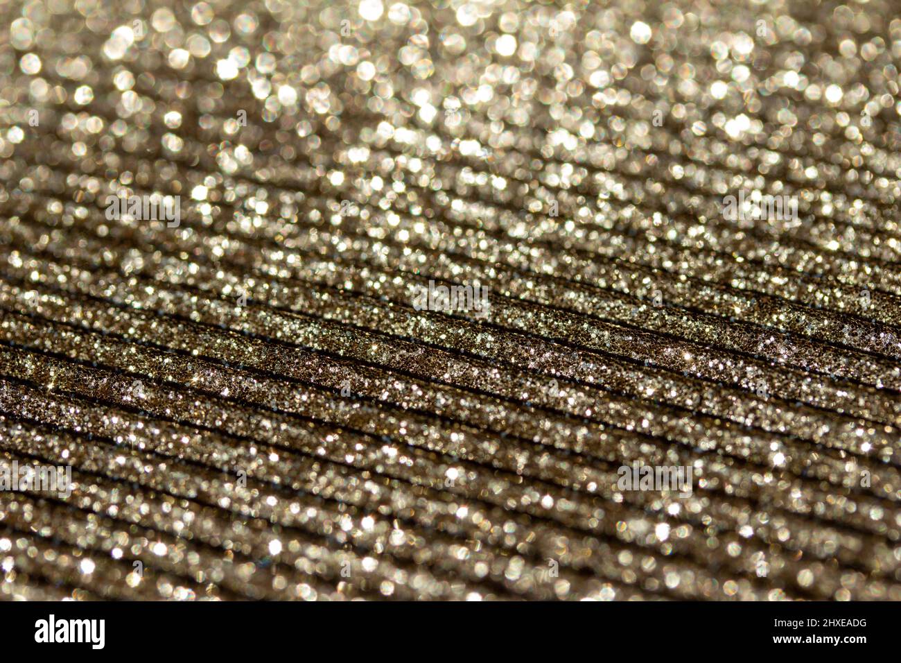 Full frame macro abstract texture of shimmering gold glitter on a ... Full frame macro abstract texture of shimmering gold glitter on a ...