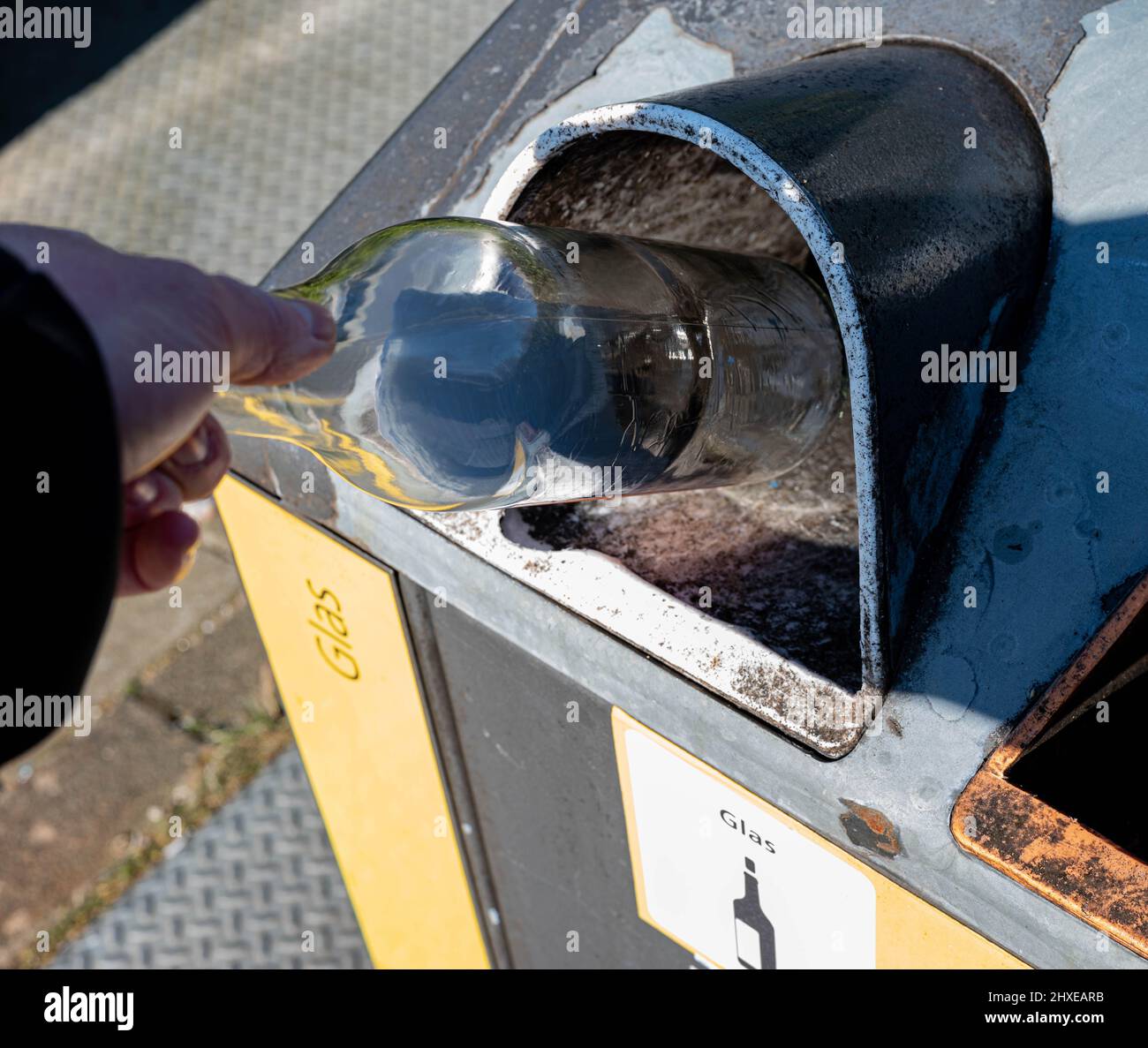 sorting, recycling and depositing glass in a container for a better ...