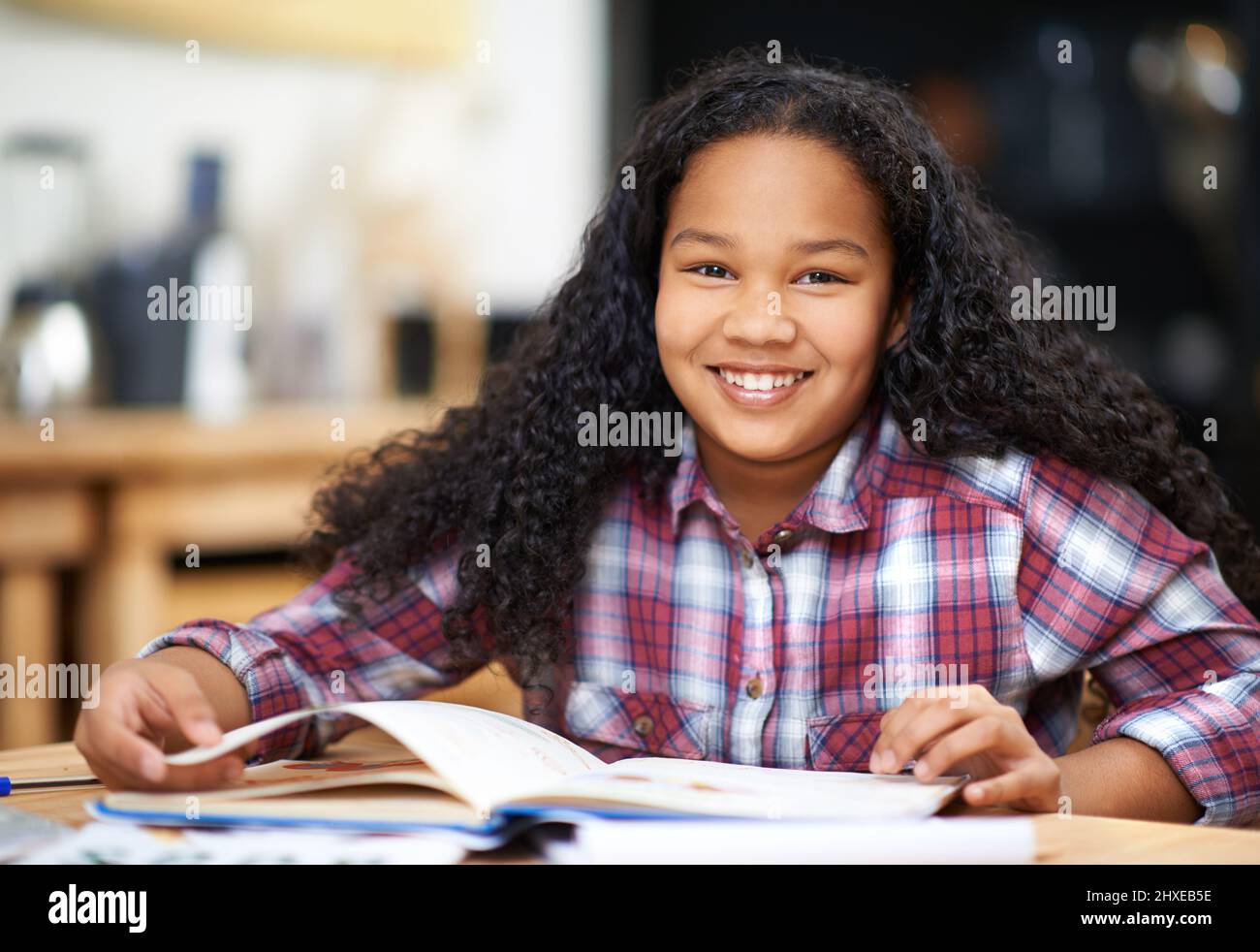 My favorite subject is everything. Portrait of a young firl studying at ...