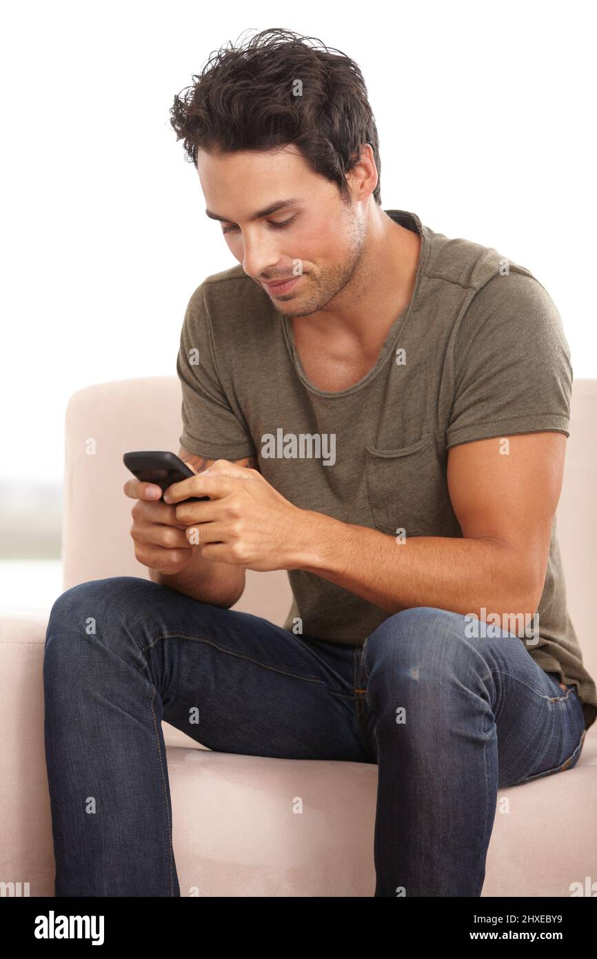 Handsome man replying text message hi-res stock photography and images ...