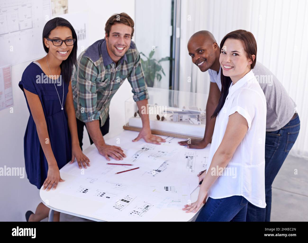 Standing behind table hi-res stock photography and images - Alamy