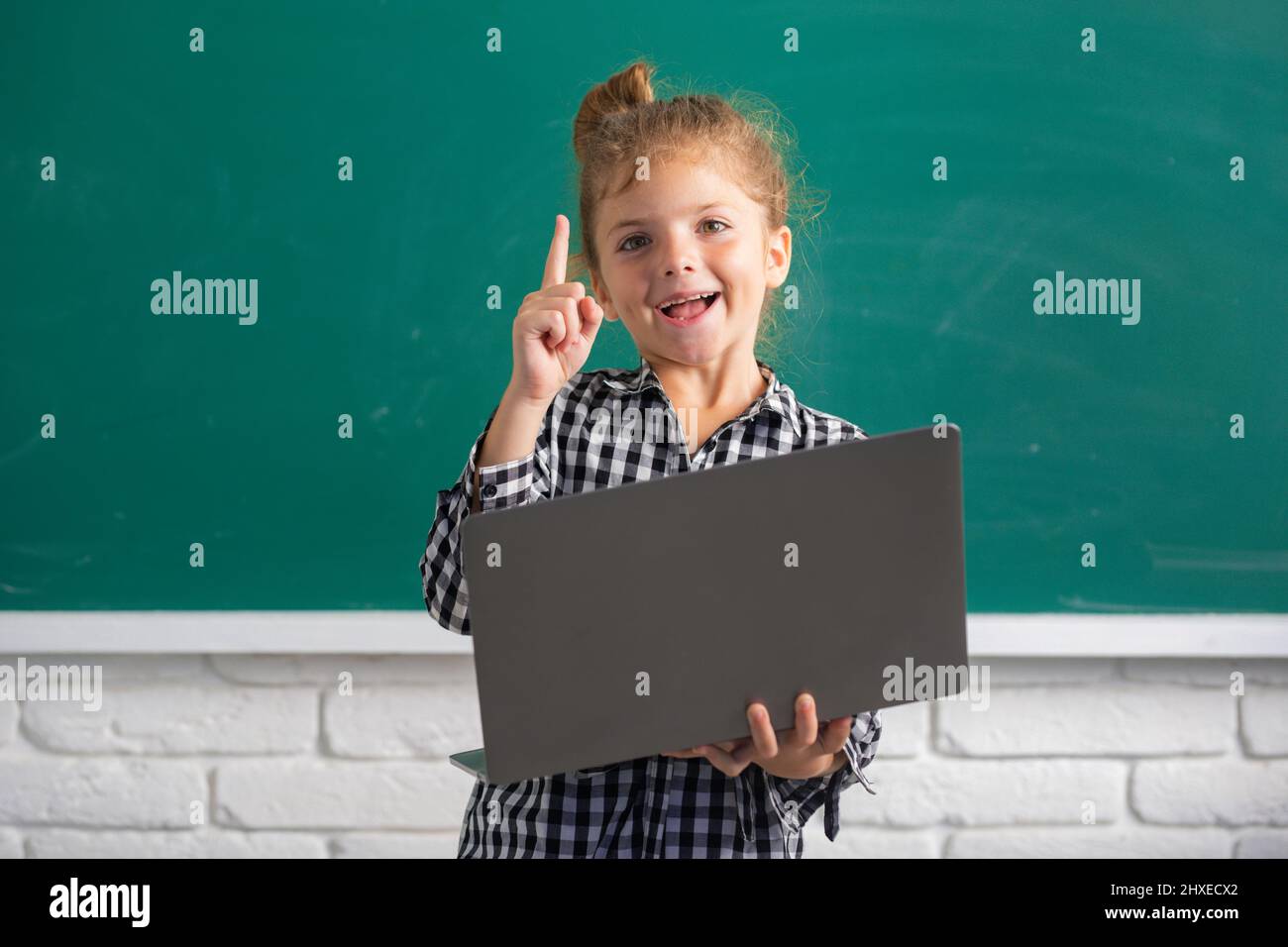School girl studying math during online lesson in classroom, online ...