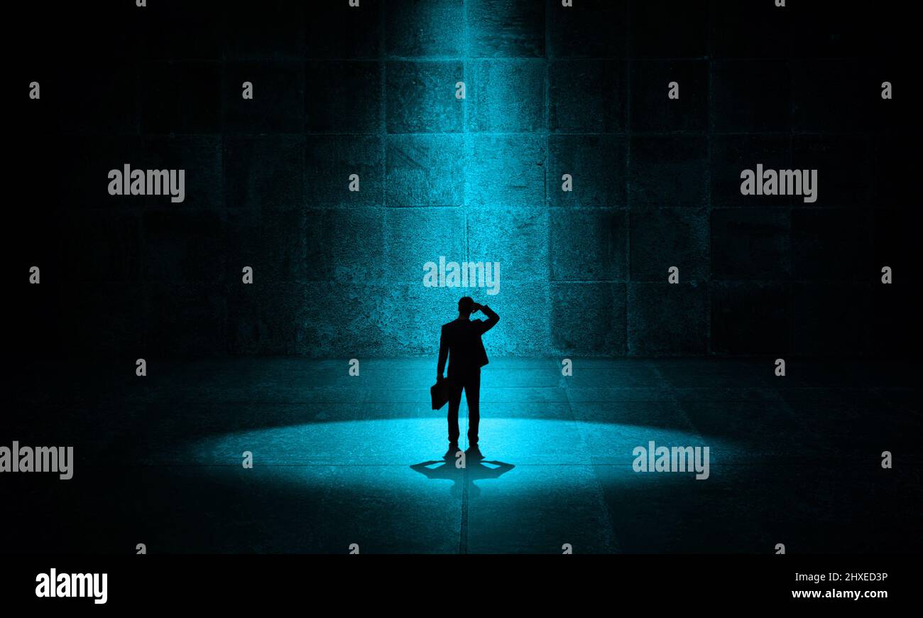 Businessman Standing in a spot light from a starry bright circle window ...