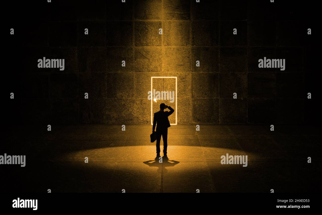 Businessman Standing in a spot light from a starry bright circle window ...