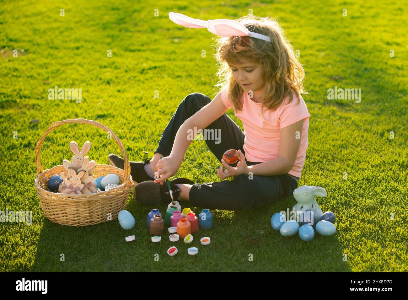 Children celebrating easter. Kid in rabbit costume with bunny ears ...