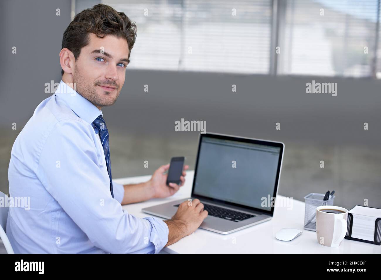 Good client communication is his priority. Portrait of a young ...