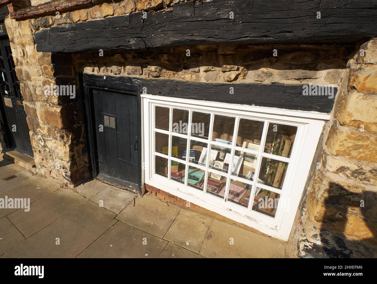 Old shop with a very short door Stock Photo - Alamy