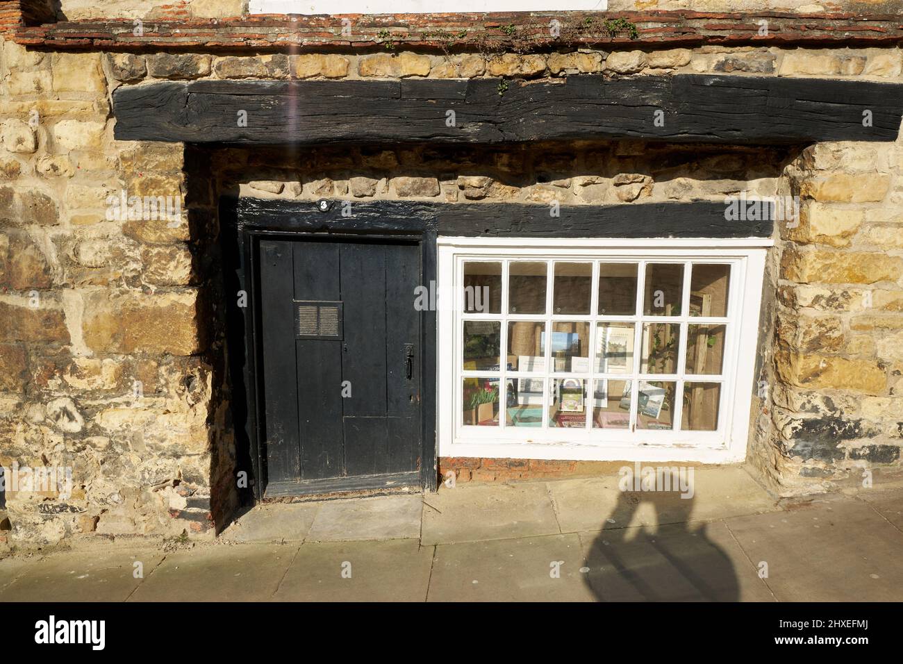 Old shop with a very short door Stock Photo - Alamy
