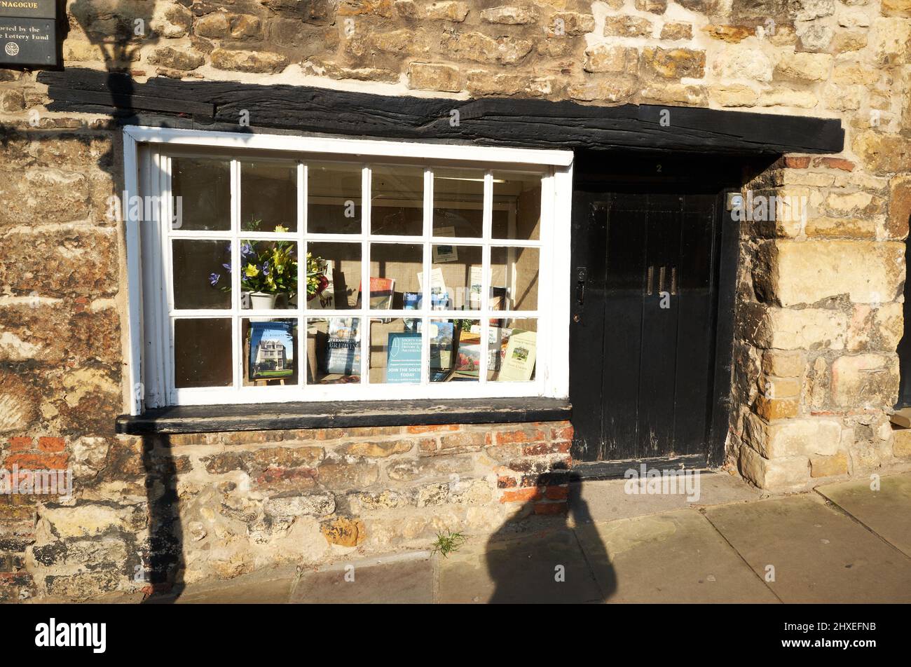 Old shop with a very short door Stock Photo - Alamy
