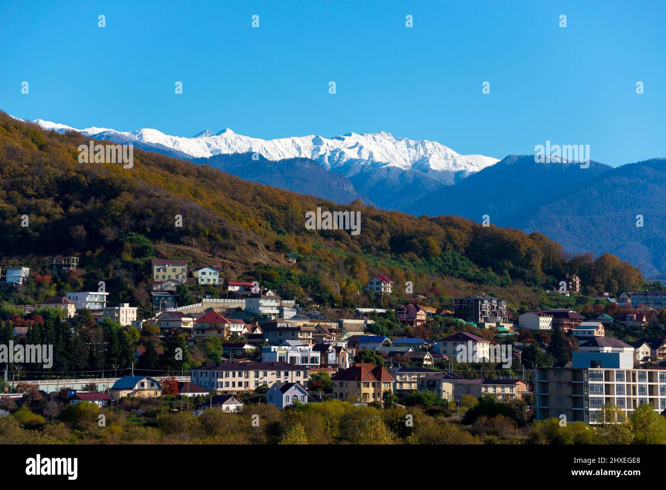Beautiful daylight scenery of snowy Caucasus mountains. Sochi, Adler ...