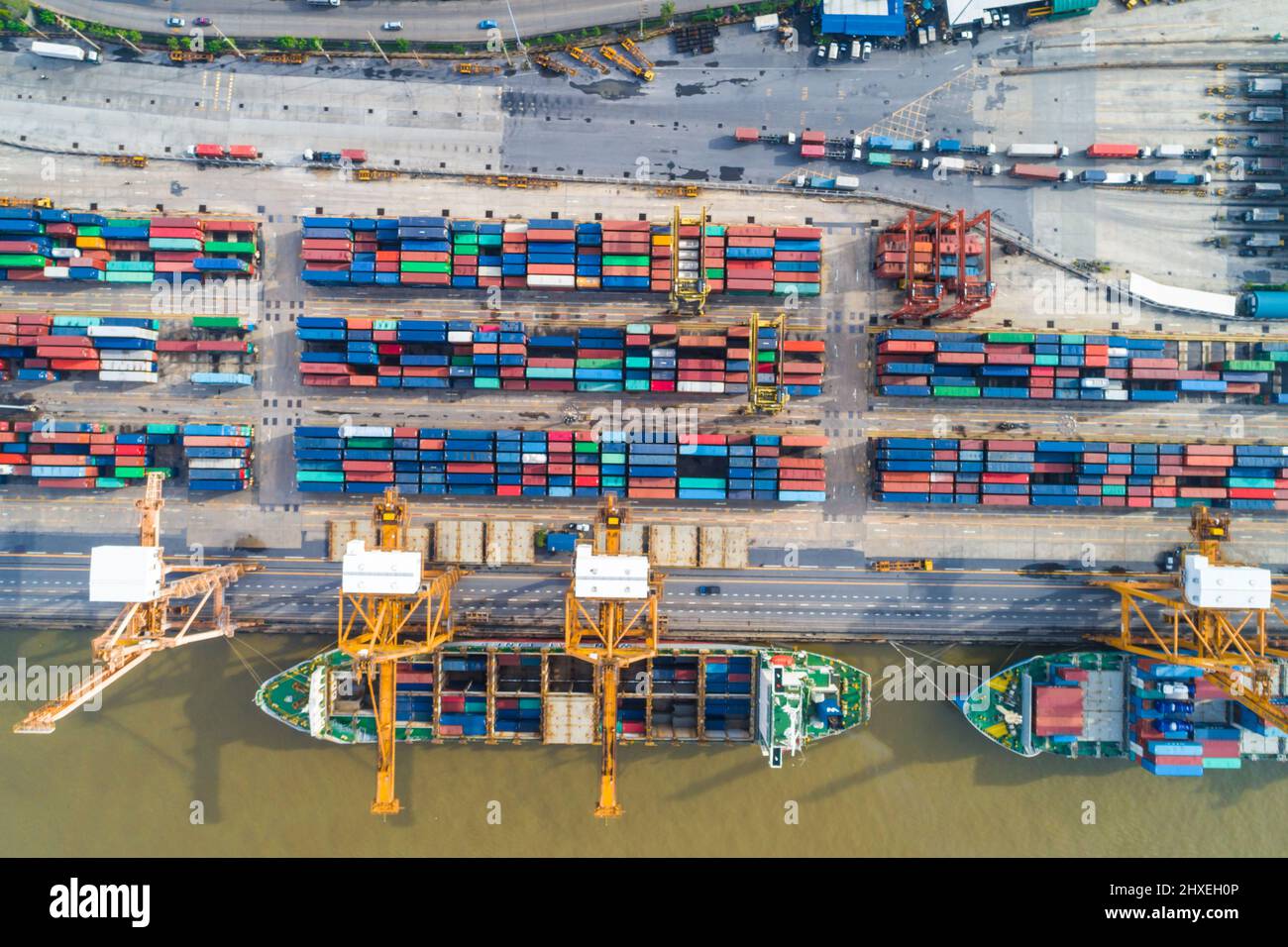 Container cargo ship with working crane bridge in shipping import ...