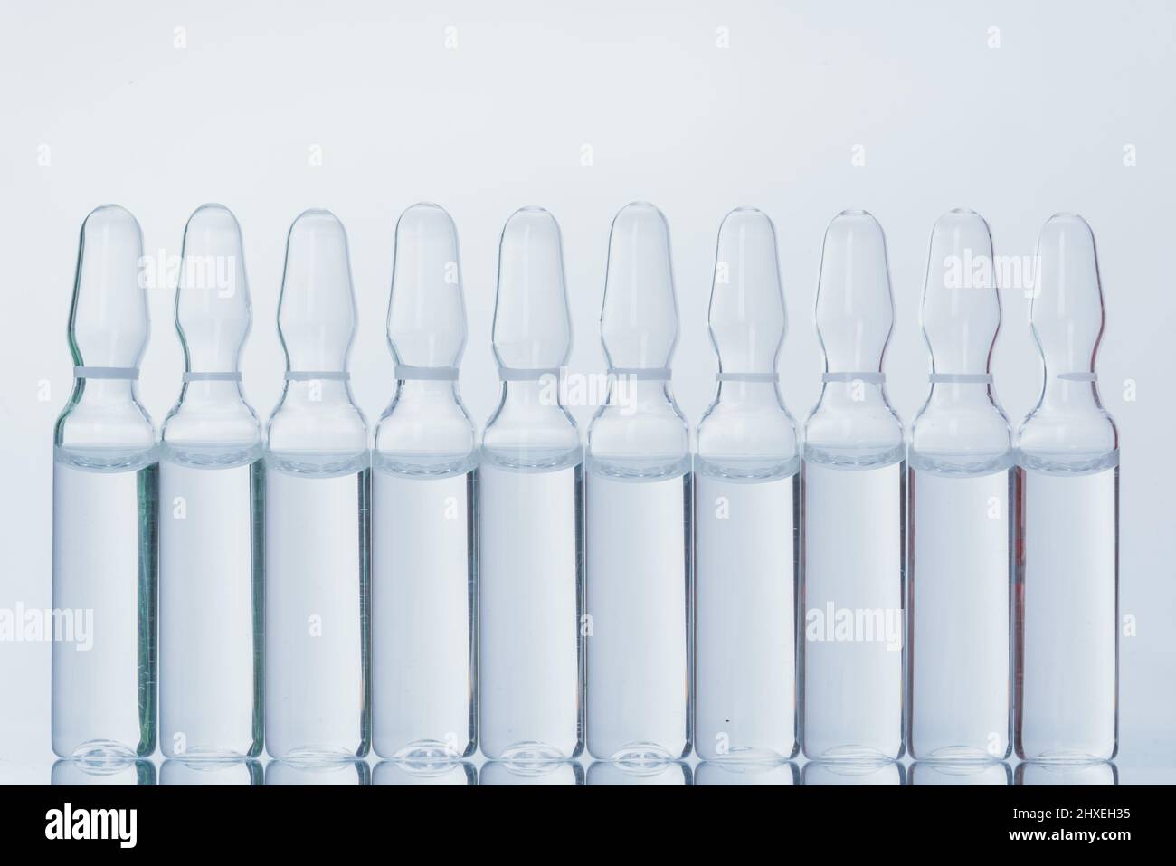 Glass medical ampoule vial for injection. Medicine is liquid sodium ...