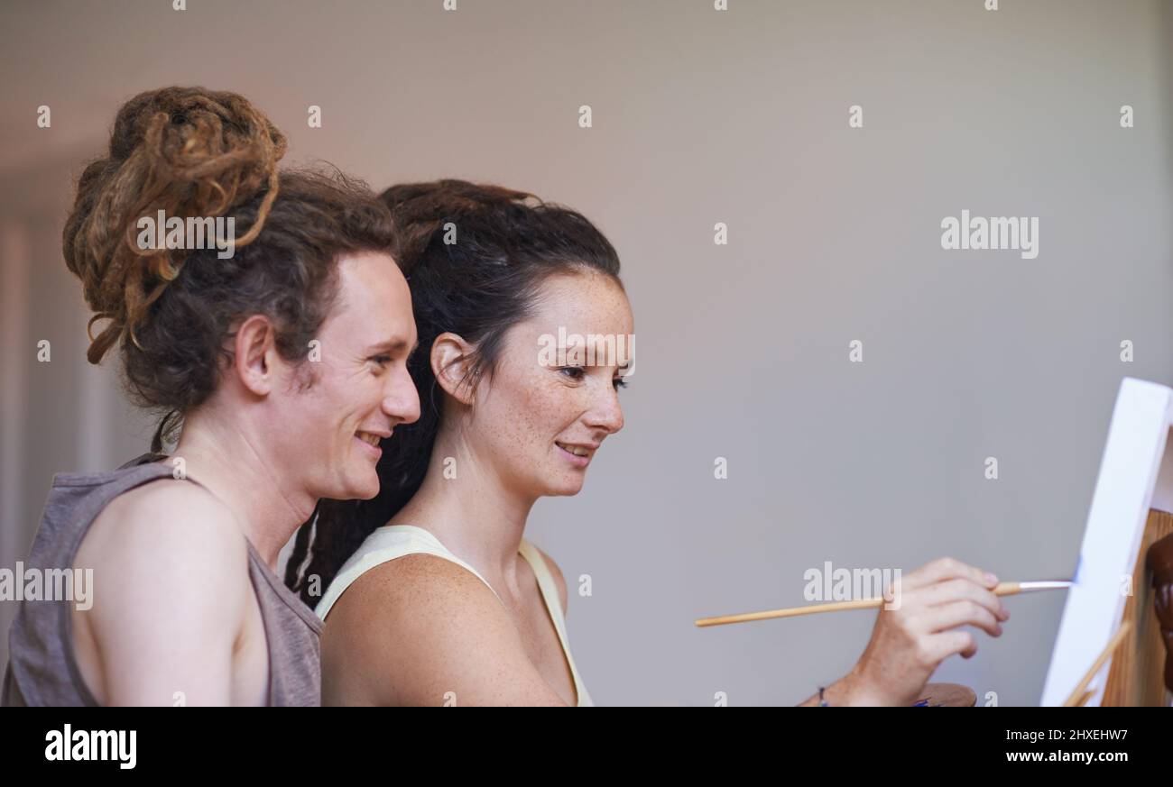 Adding a touch of her own unique style. A cropped view of a young ...