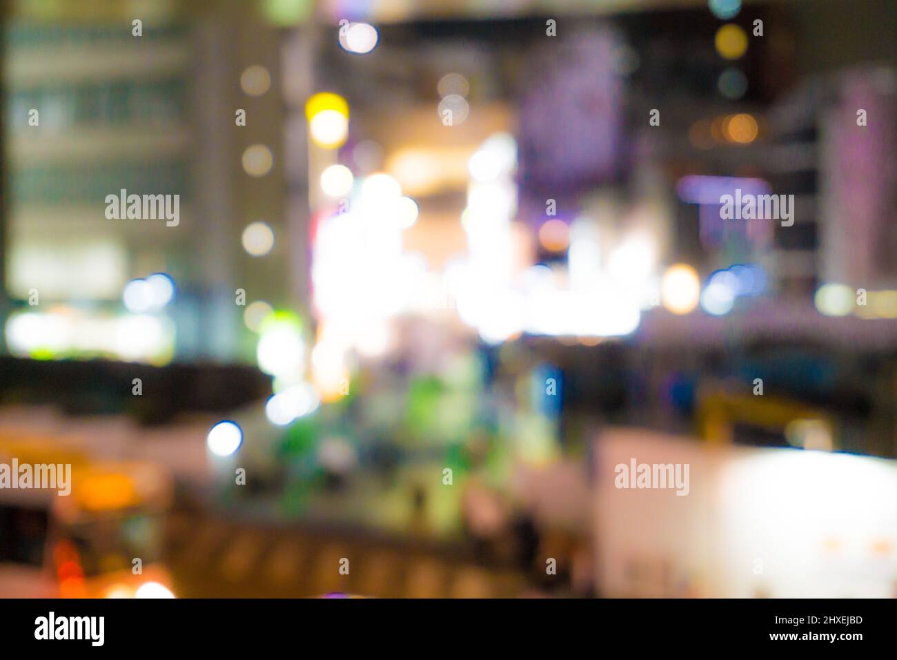 Abstract blurred night city road building people at Shibuya junction ...