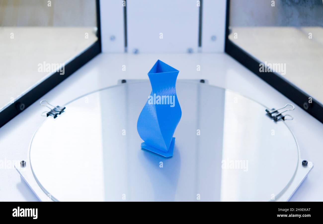 Bright blue object printed by 3d printer on 3d printer inside Stock ...
