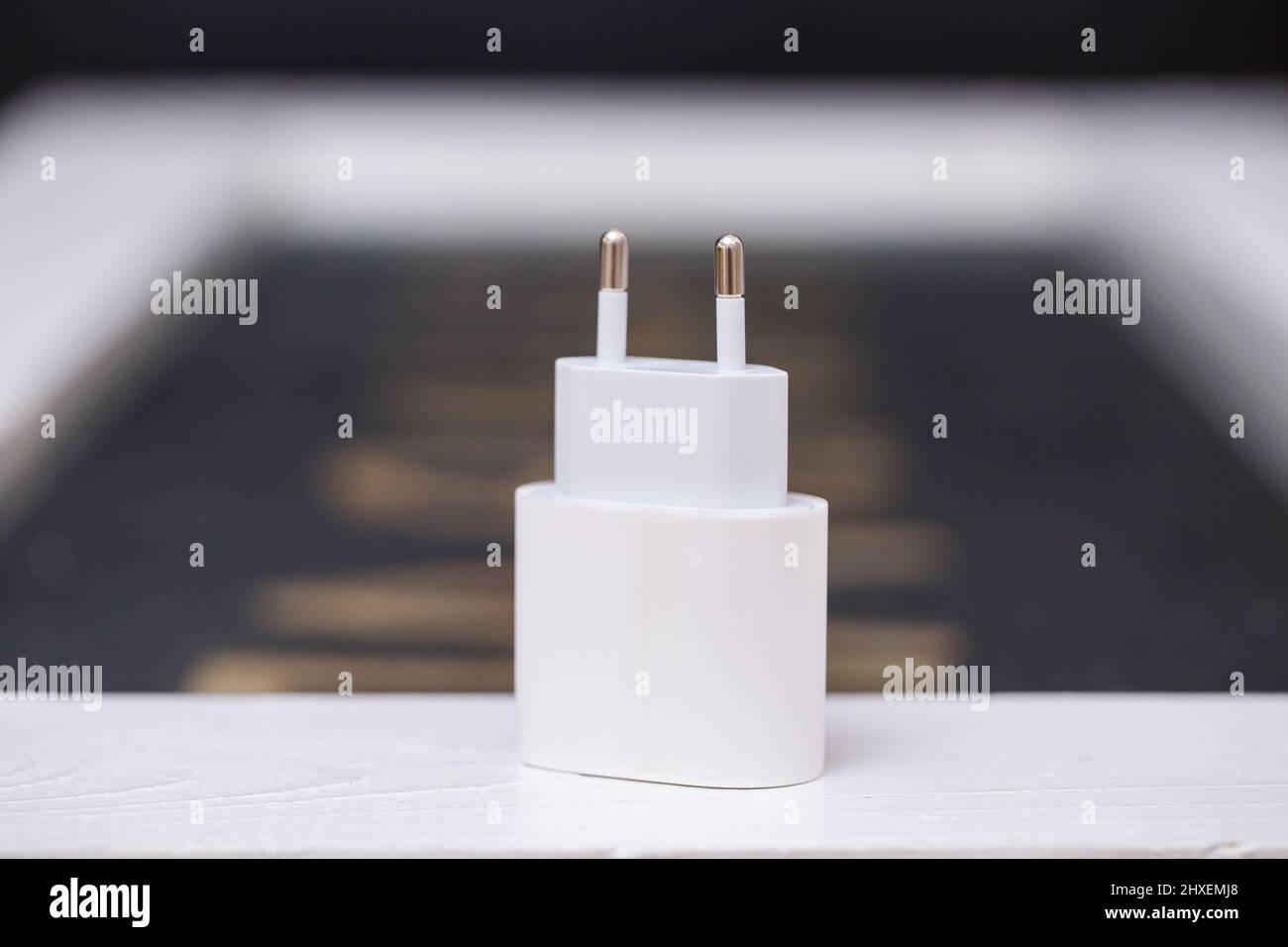 White USB charger for gadgets and mobile phones. Charging from the ...