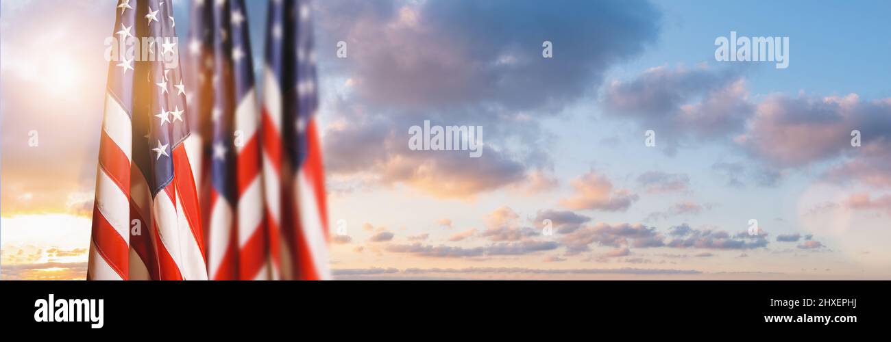 American flag against sunset sky with clouds for Memorial Day, 4th of ...