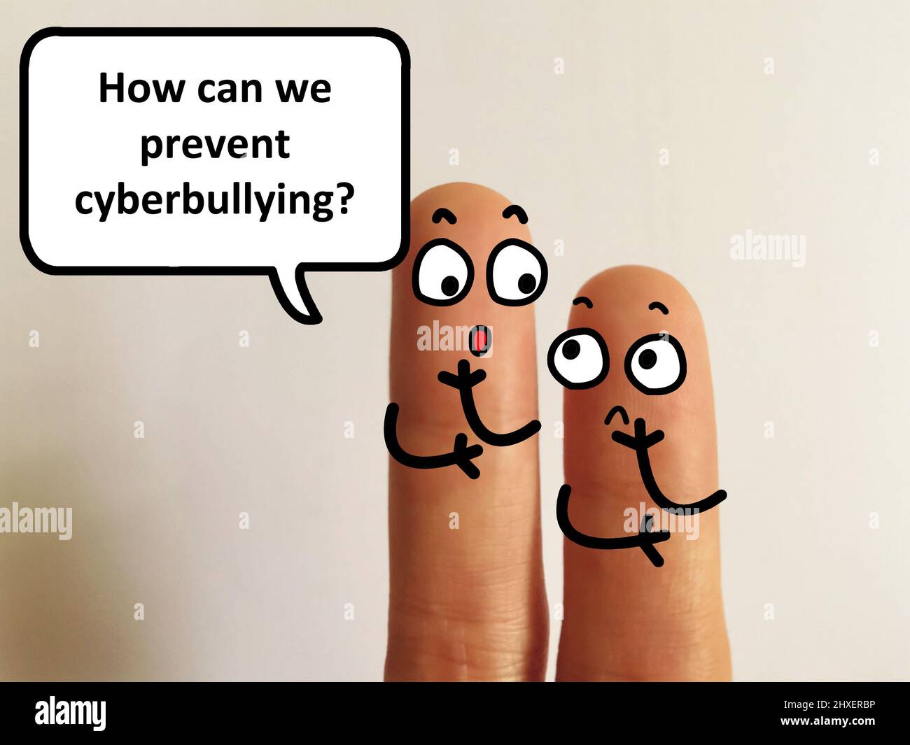 Two fingers are decorated as two person. They are discussing about ...