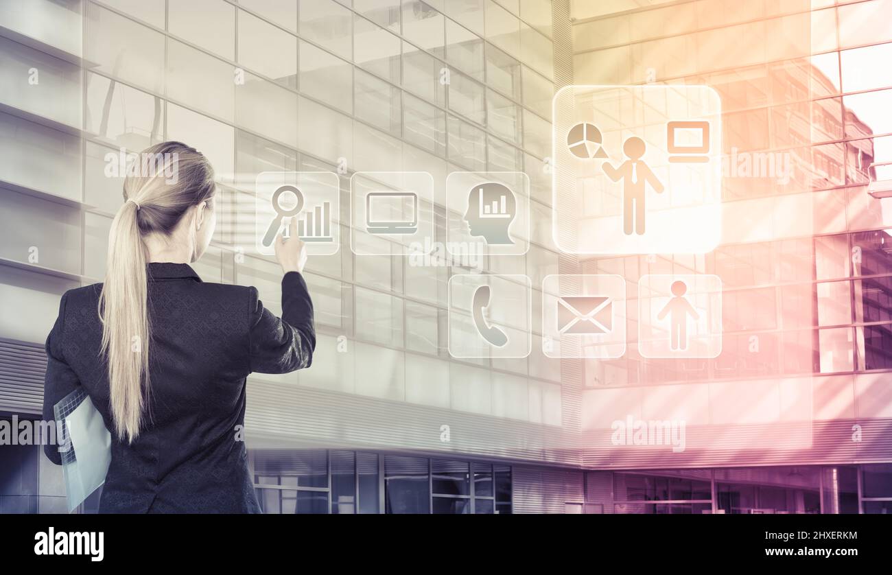 Businesswoman pressing icons on virtual digital touchscreen Stock Photo ...