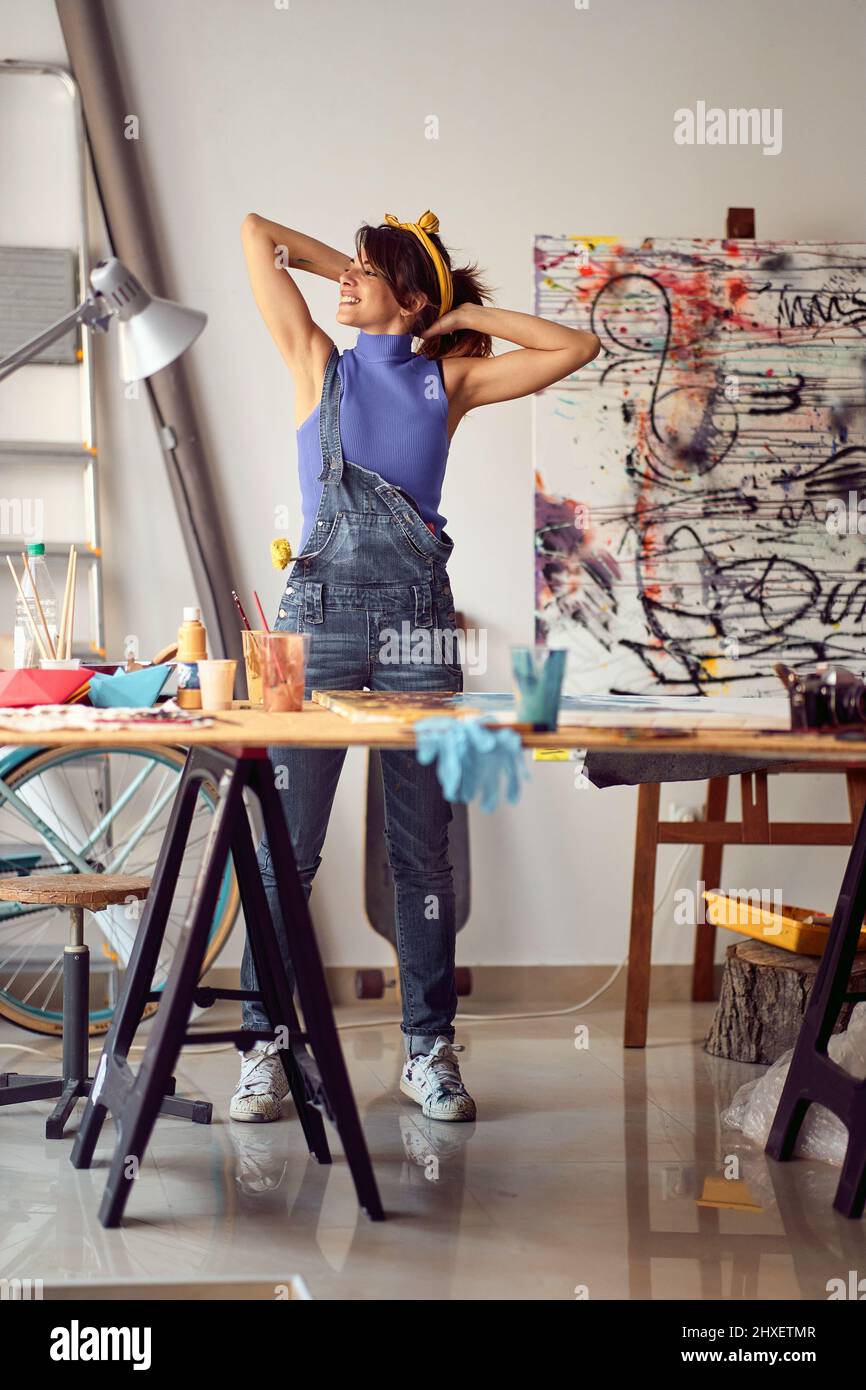 Woman artist.Girl artist standing next to the easel with canvas ...