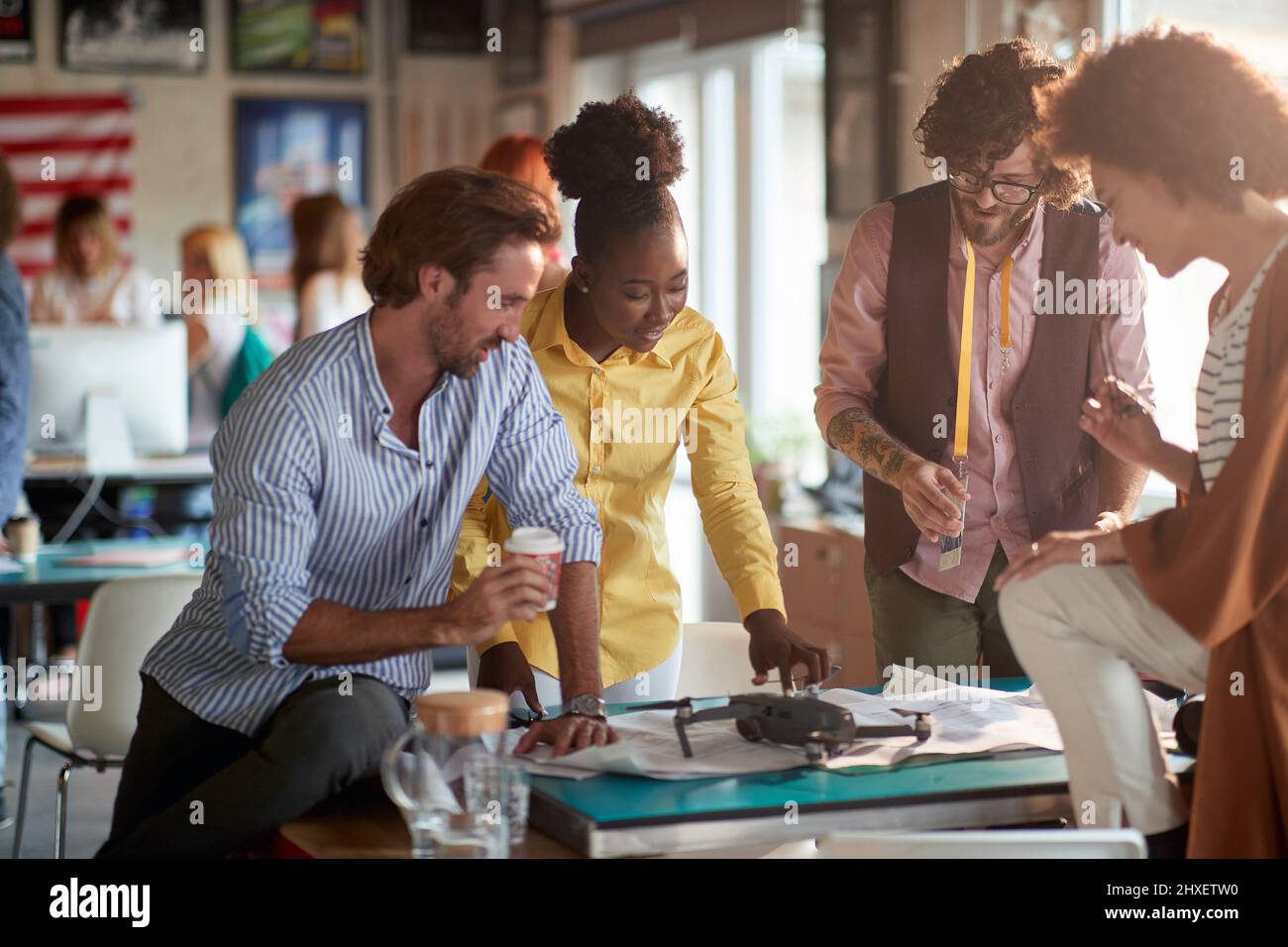 group of people considering possibilities using the drone for filming ...