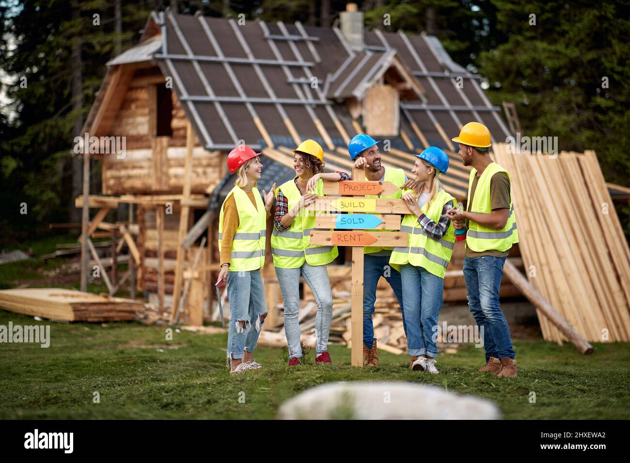 Young construction workers.Teamwork.Building. woodworking team work ...