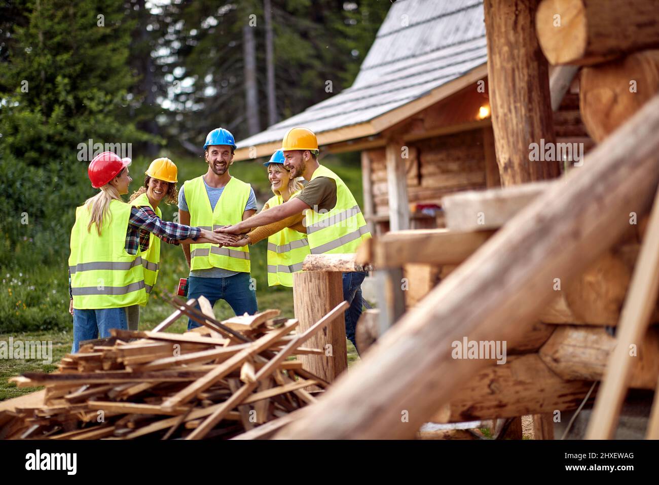 Teamwork young construction workers.Construction workers together ...