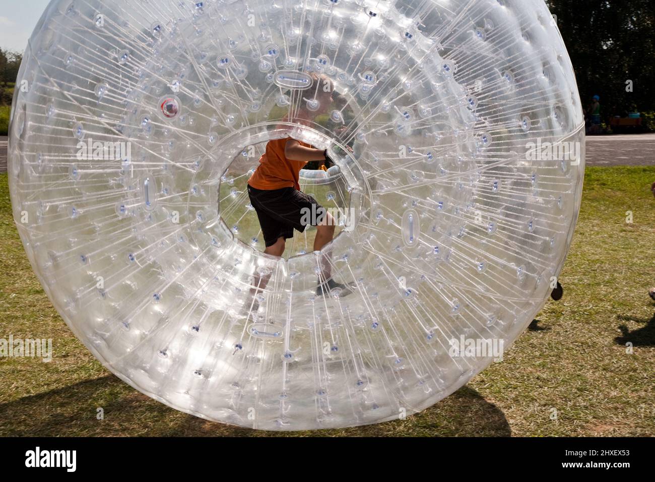 child has a lot of fun in the Zorbing Ball Stock Photo - Alamy