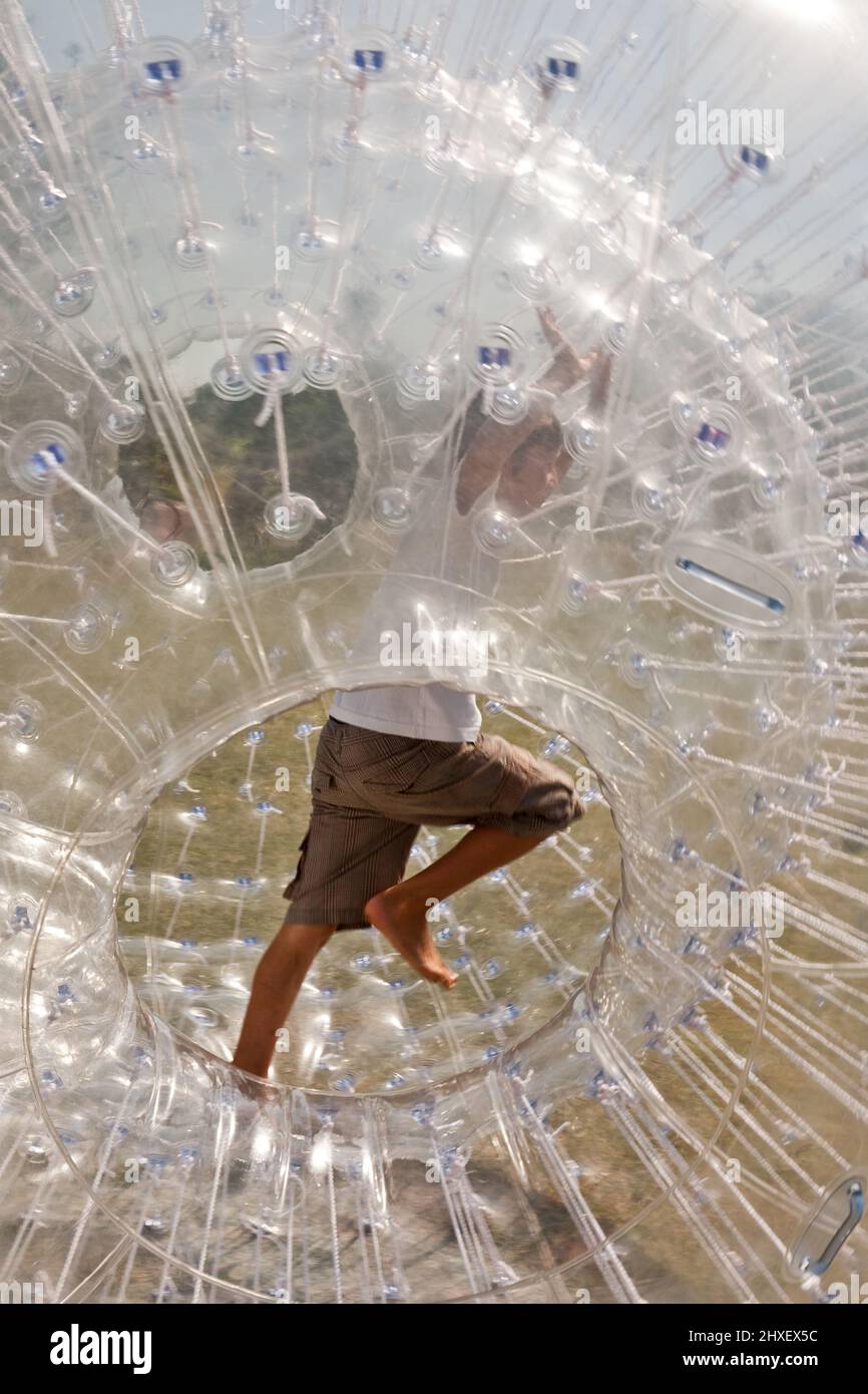 child has a lot of fun in the Zorbing Ball Stock Photo - Alamy