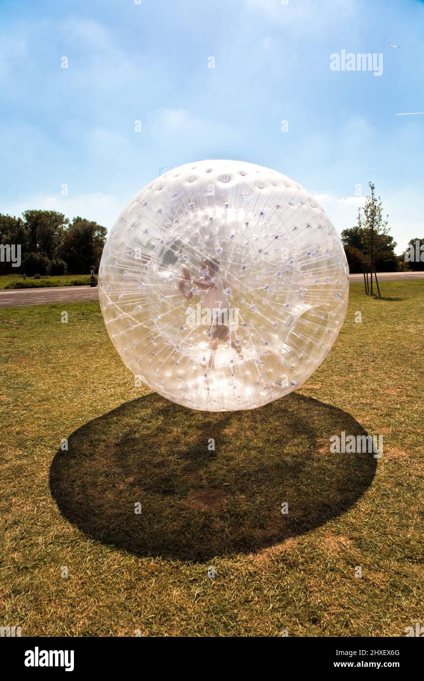 child has a lot of fun in the Zorbing Ball Stock Photo - Alamy
