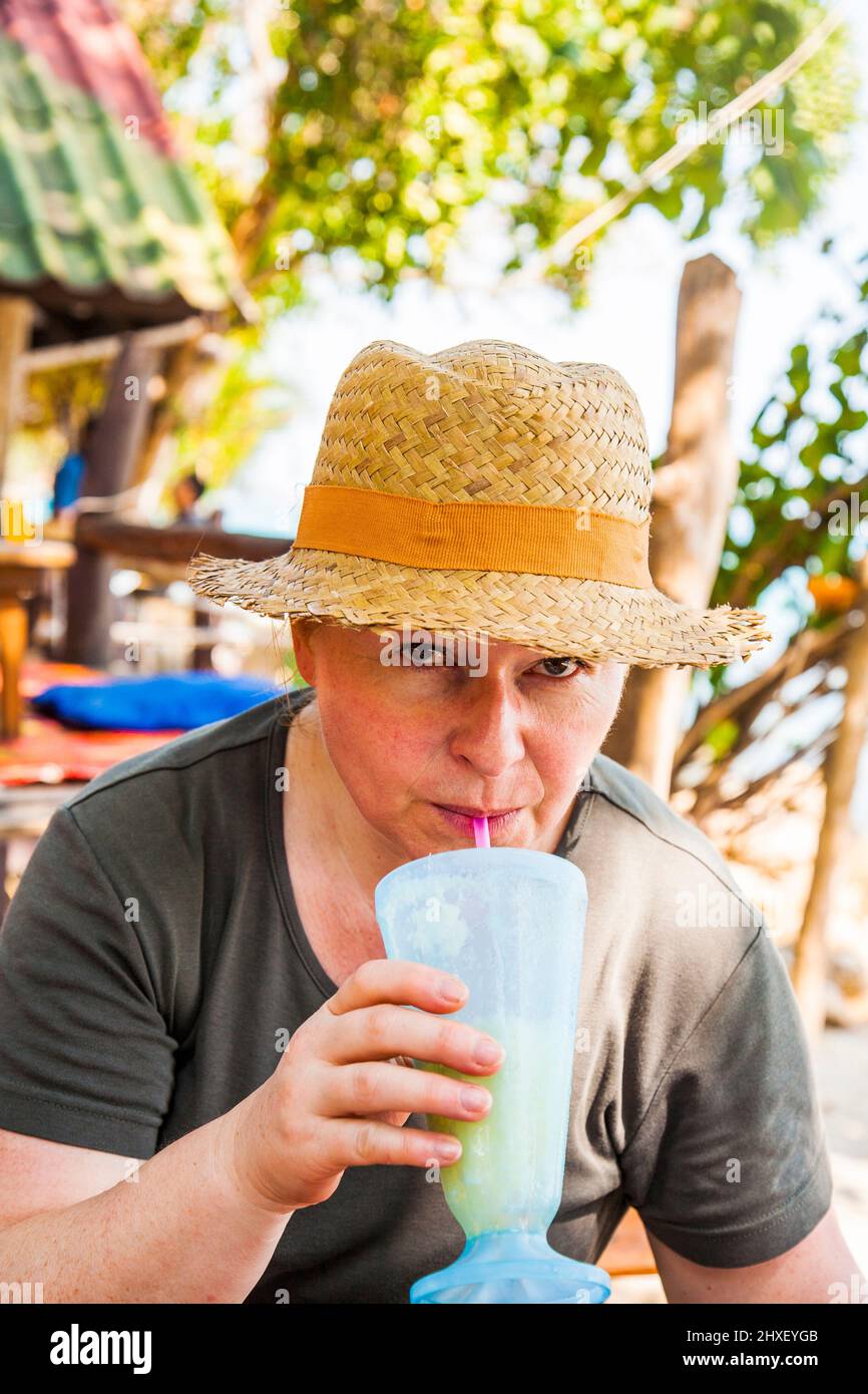 woman has a fruit drink in the tropical open air restaurant Stock Photo ...
