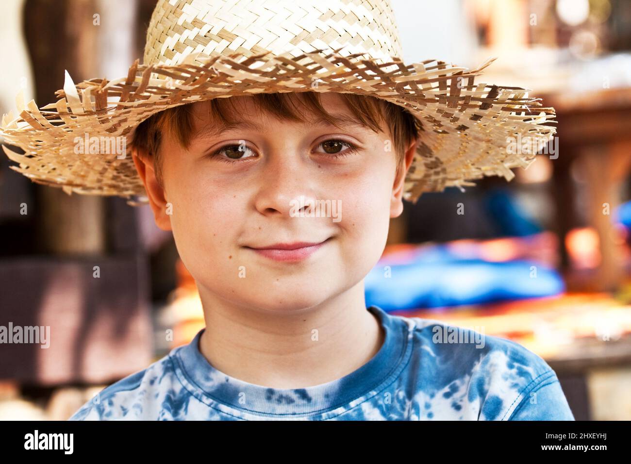 young boy with straw hat is happy and smiles Stock Photo - Alamy