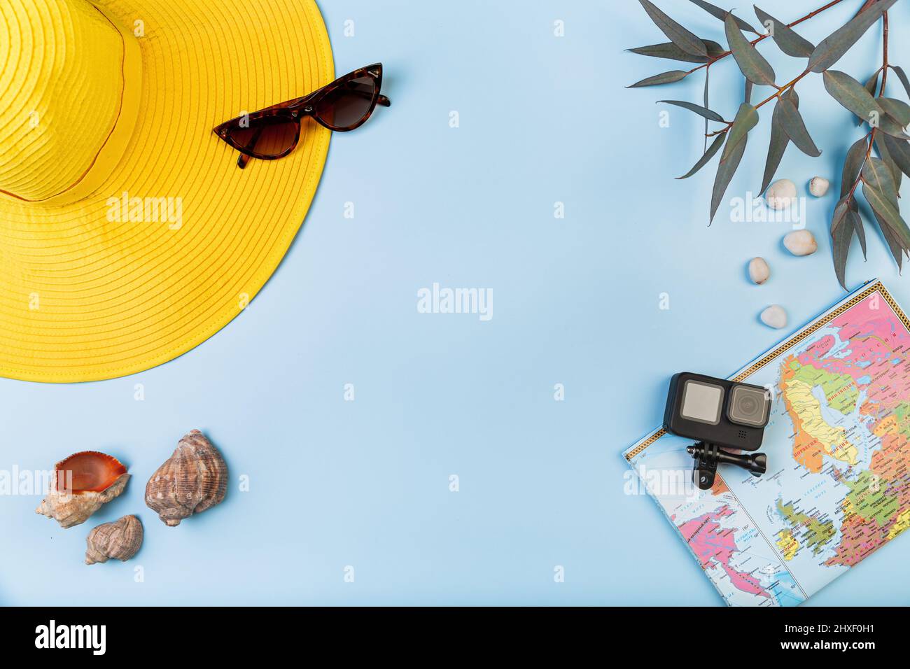 Summer vacation layout, on a blue background map of the world, shells ...