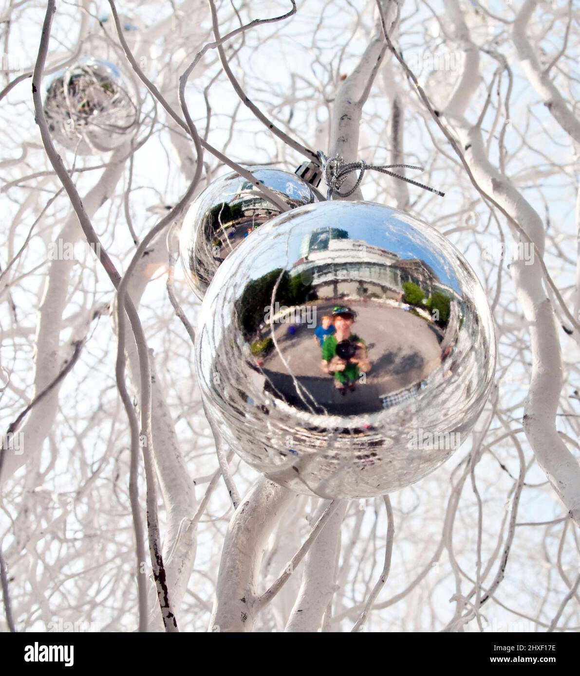 christmas tree balls and mirroring of father and sun with fun Stock ...