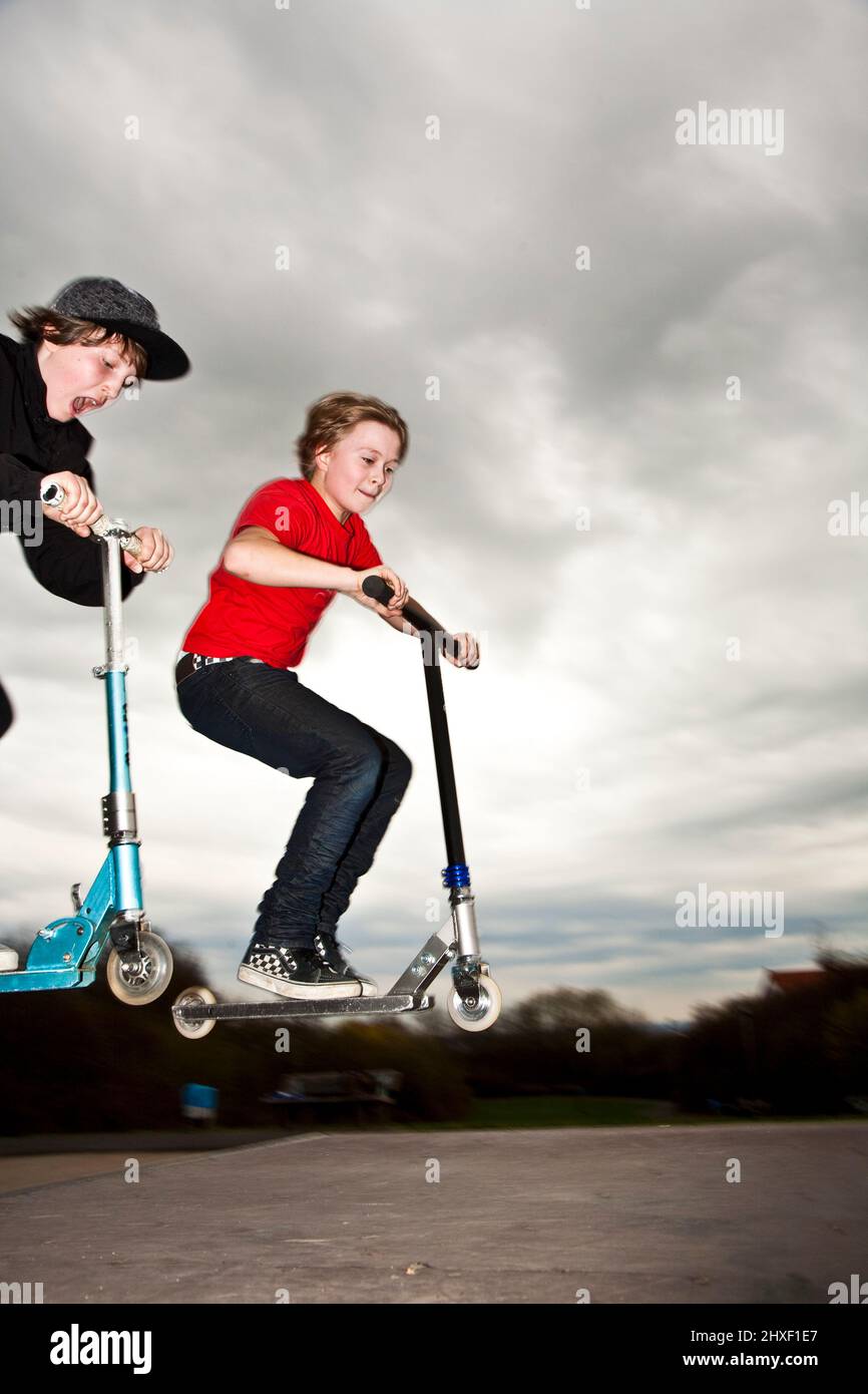 Boy riding a scooter going airborne at a scooter park Stock Photo - Alamy