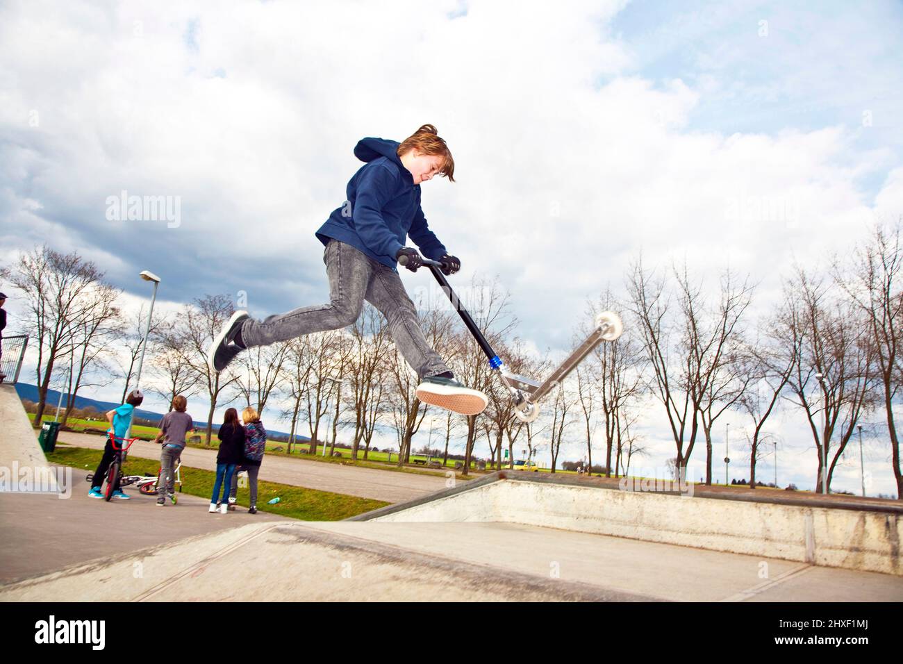 boy is going airborne witha scooter Stock Photo - Alamy