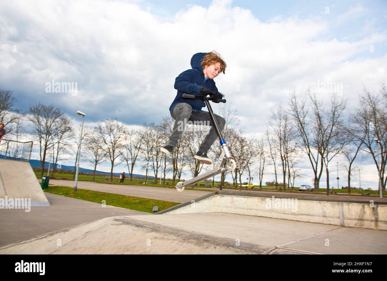 boy is going airborne witha scooter Stock Photo - Alamy