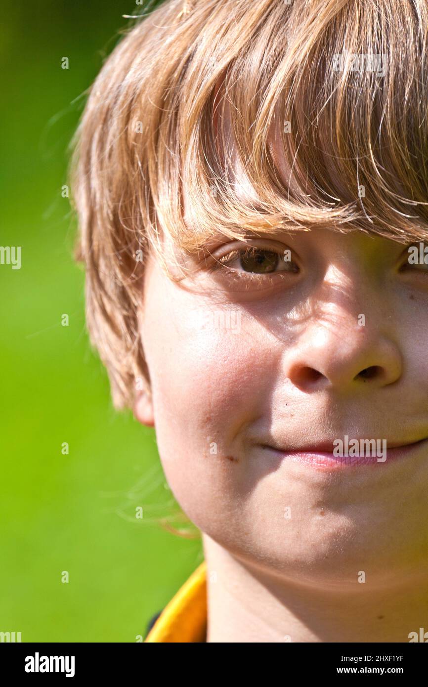 portrait of cute smiling boy in nature Stock Photo - Alamy