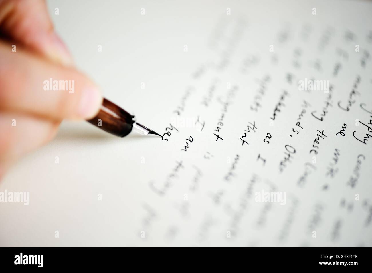 Writing letter to a friend. Hand holding a fountain pen Stock Photo - Alamy