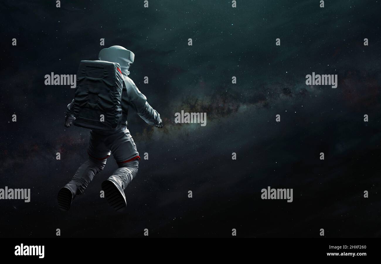 Astronaut at spacewalk looks at Milky Way. Elements of image provided ...