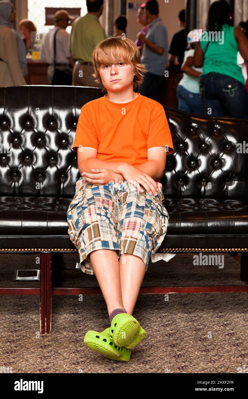 boy takes a rest at a sofa in the Entrance of the Smithonean Museum in ...